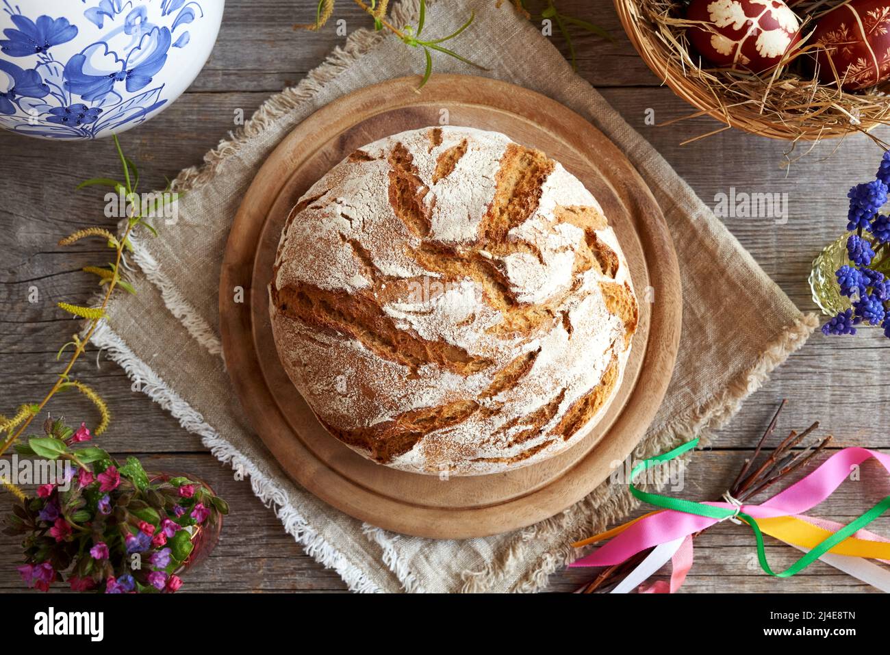 Homemade sourdough bread with Easter eggs, spring flowers and Czech ...