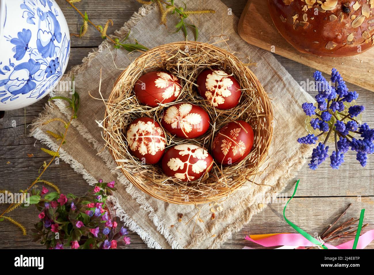 Easter eggs dyed with onion peels with spring flowers and mazanec ...