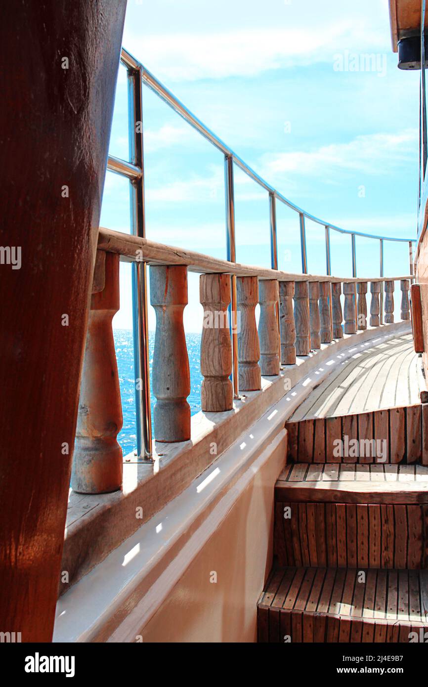 Wooden stair on deck of ship. Behind sea. Travel concept, vacation ...