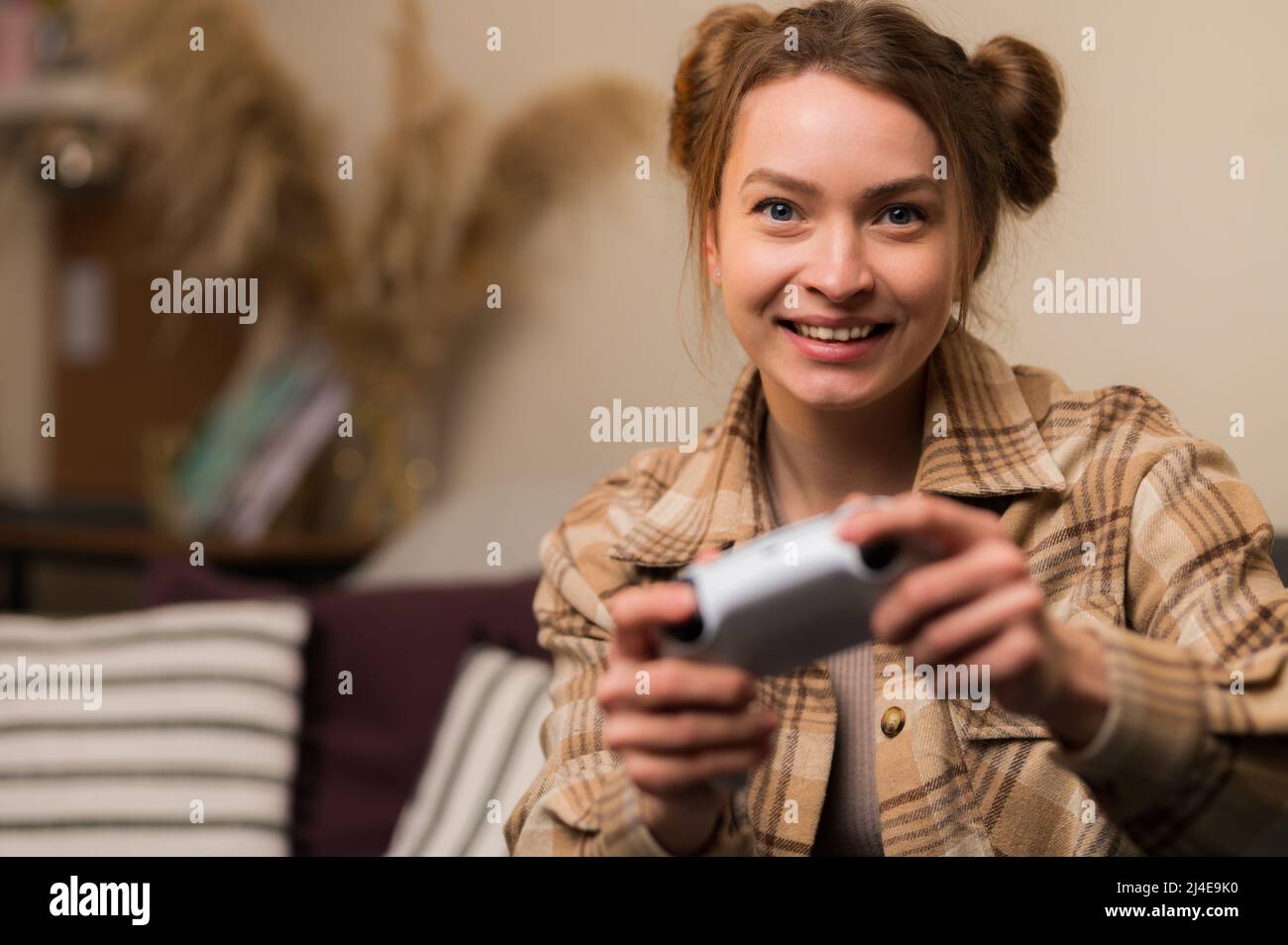 Girl Gamer Plays A Video Game She Has A Joystick In Her Hand The Girl