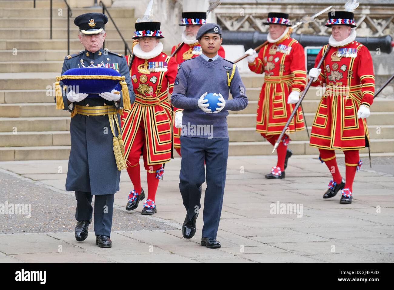A member of the Royal Air Force Air Cadets (centre) holding the ...