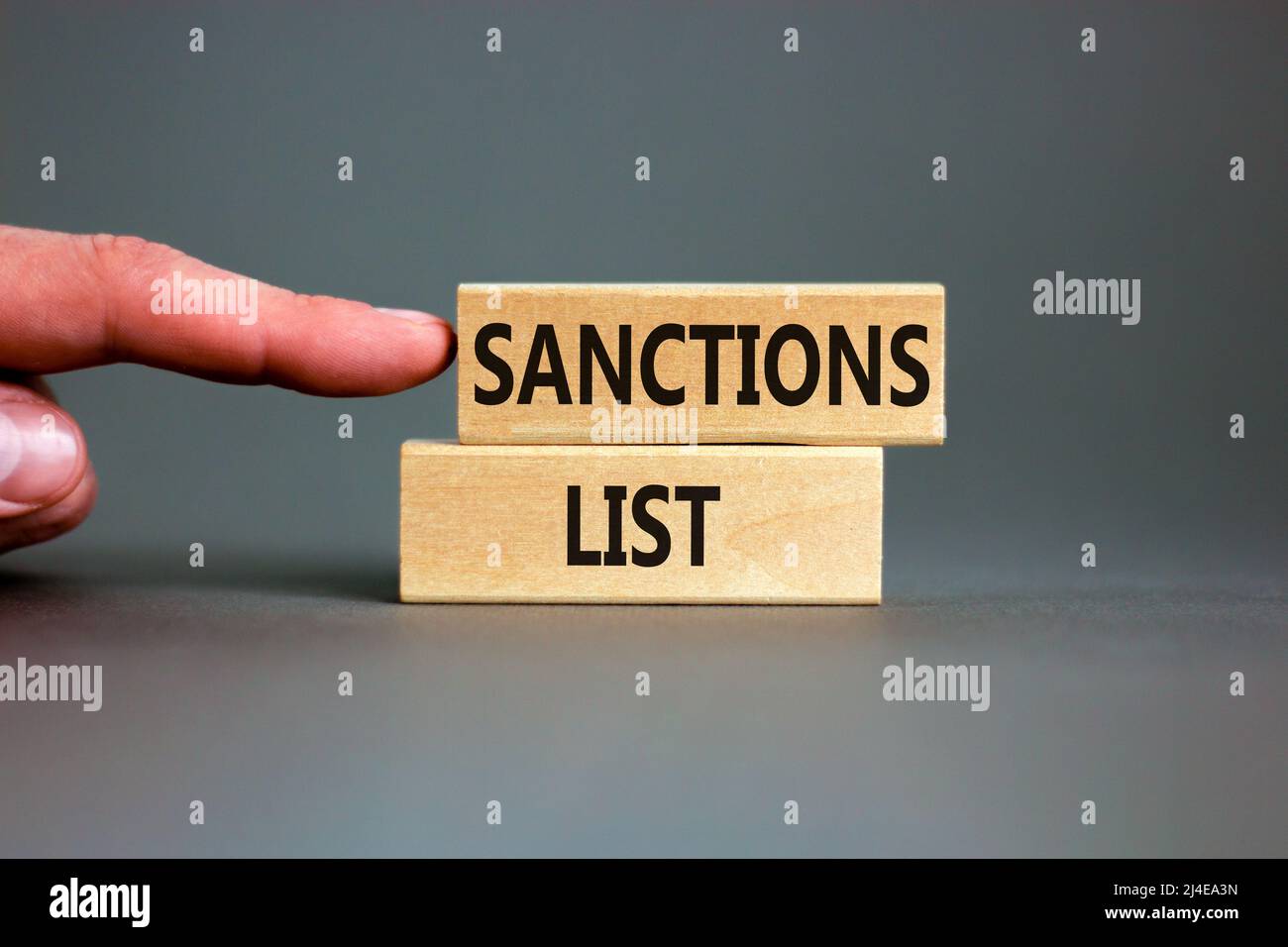 Sanctions list symbol. Wooden blocks with concept words Sanctions list ...