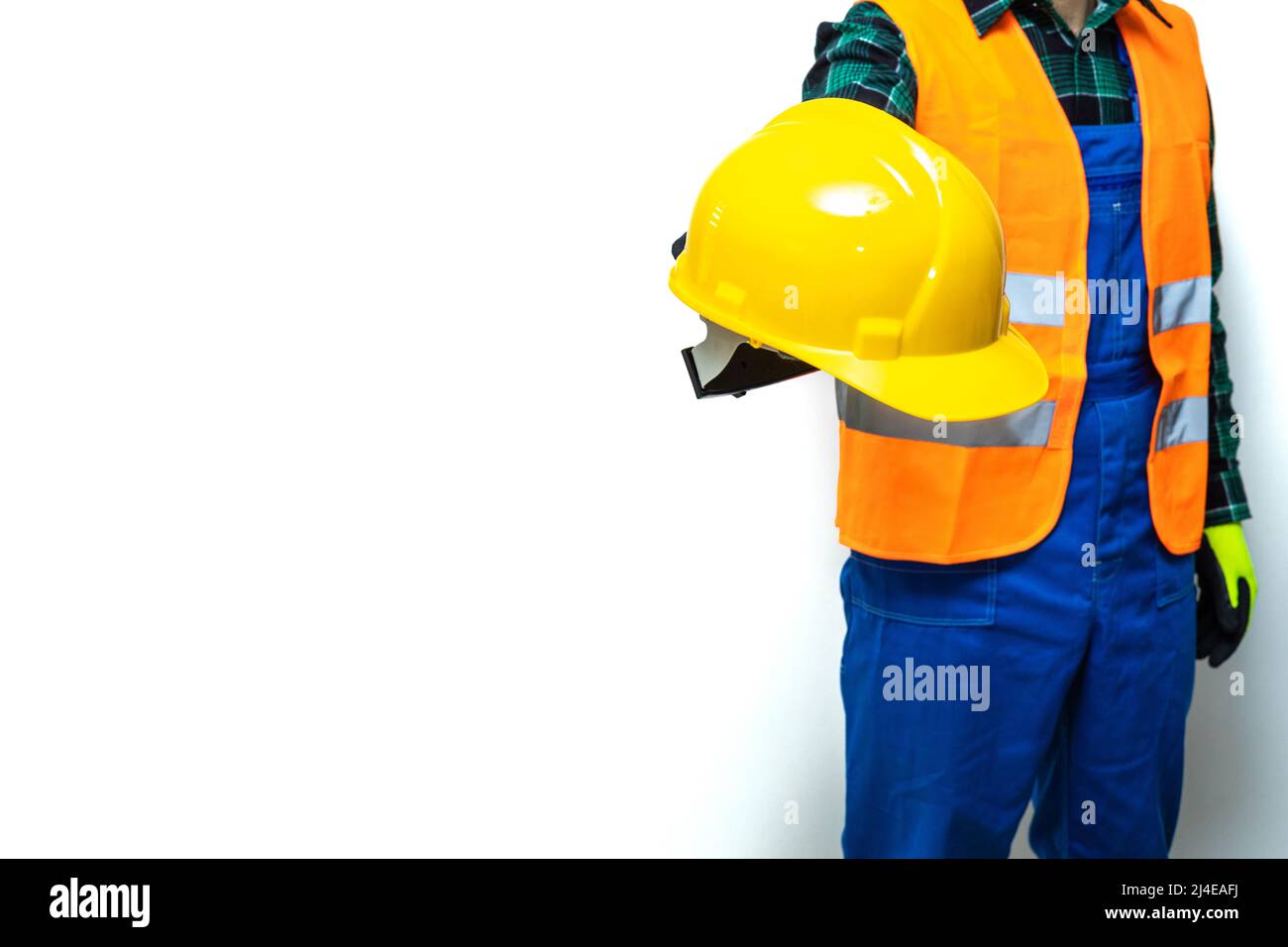 Construction or road worker wearing a high-visibility vest with a ...