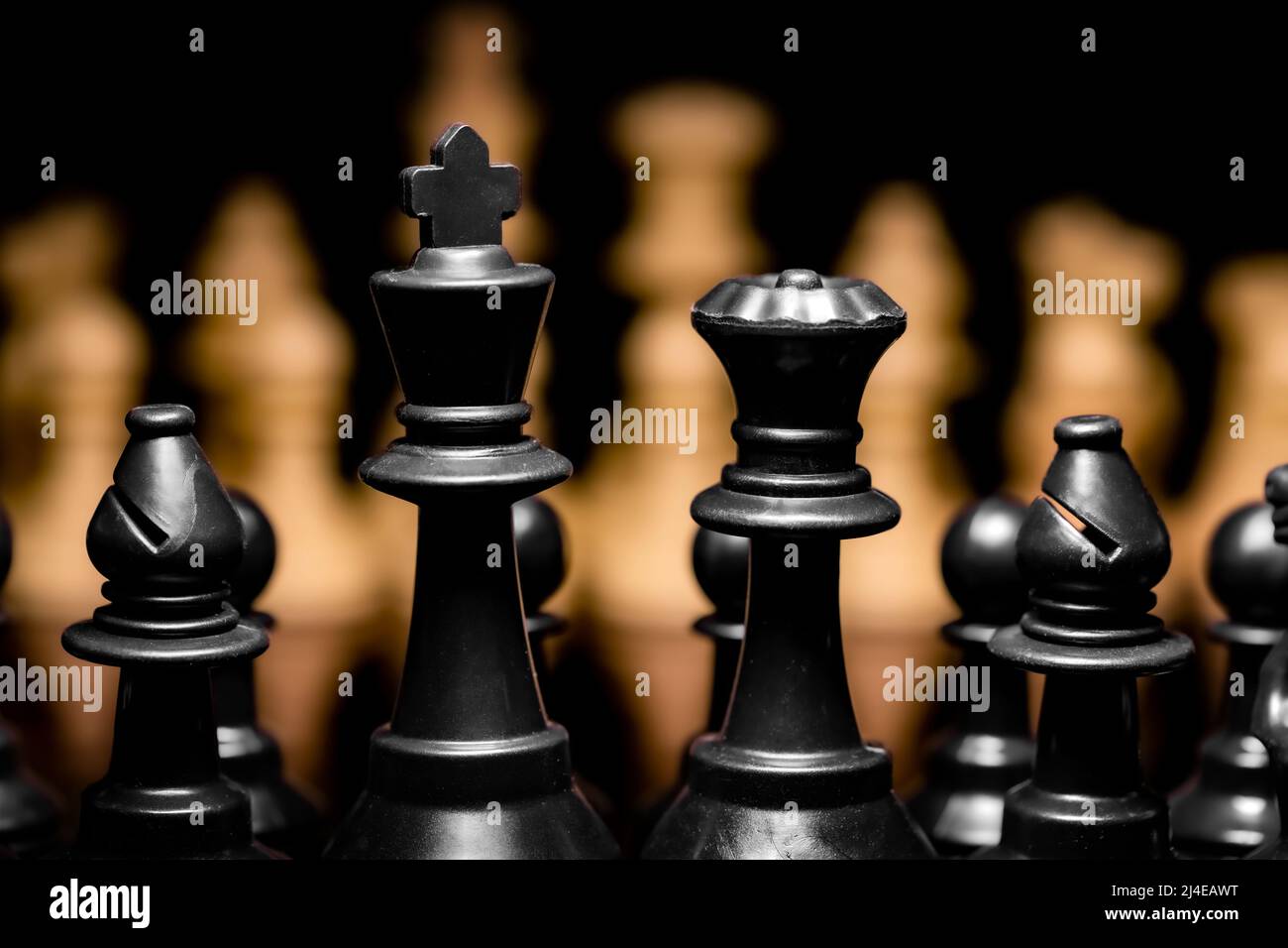 Close up of Chess pieces on a reflective mirror board surface with a ...