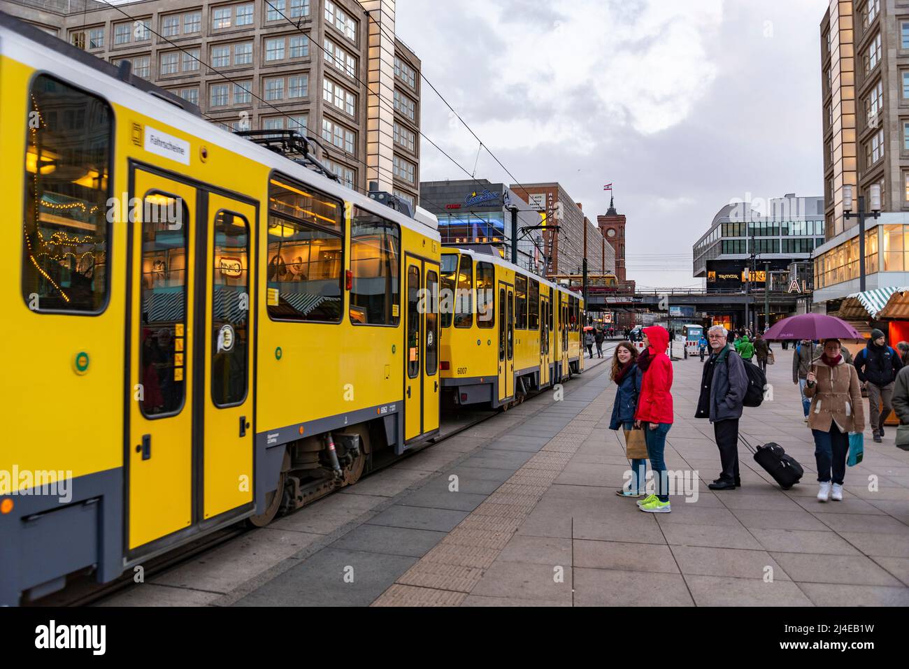 Yellow public transportation tram passing by the city of Berlin Germany ...