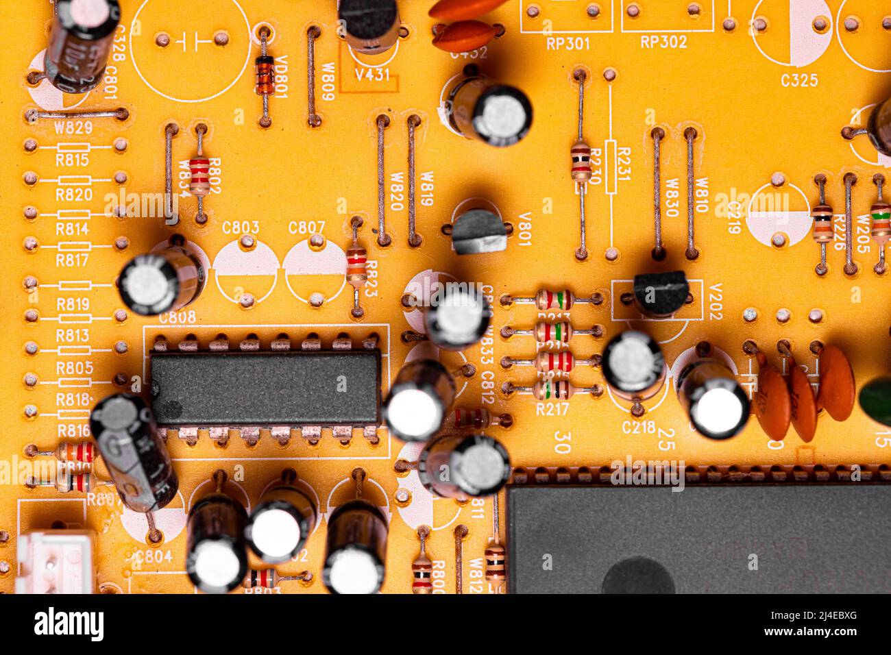 Macro Close up of components and microchips on old PC circuit board ...