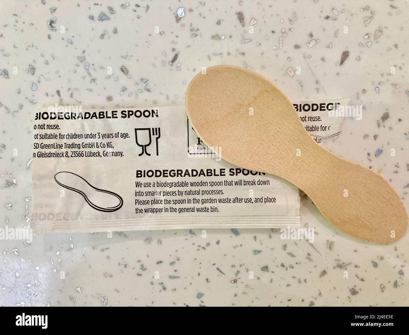 Biodegradable wooden spoon for sustainable waste disposal Stock Photo ...