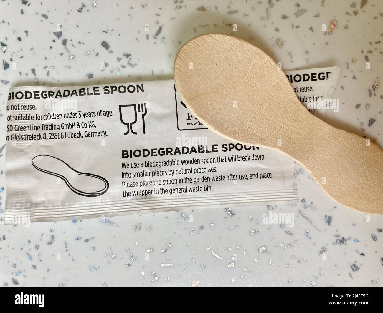 Biodegradable wooden spoon for sustainable waste disposal Stock Photo ...