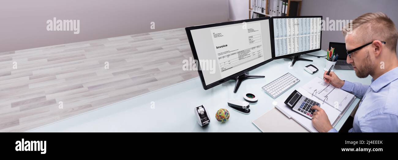 Side View Of A Young Businessman Calculating Invoice With Calculator At ...