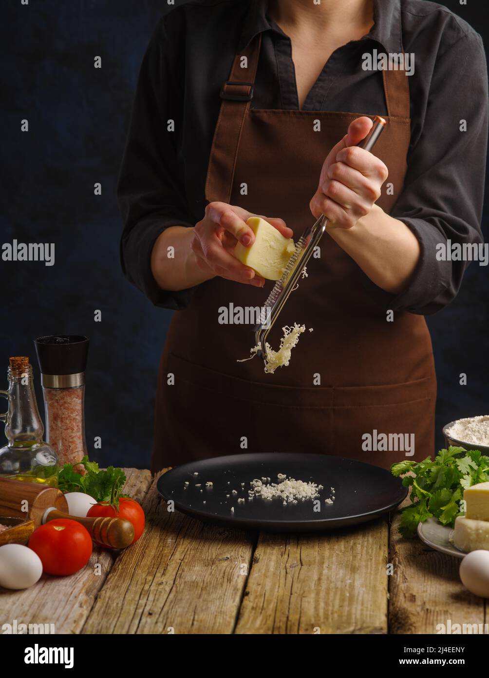 Person grates parmesan cheese on hi-res stock photography and images ...