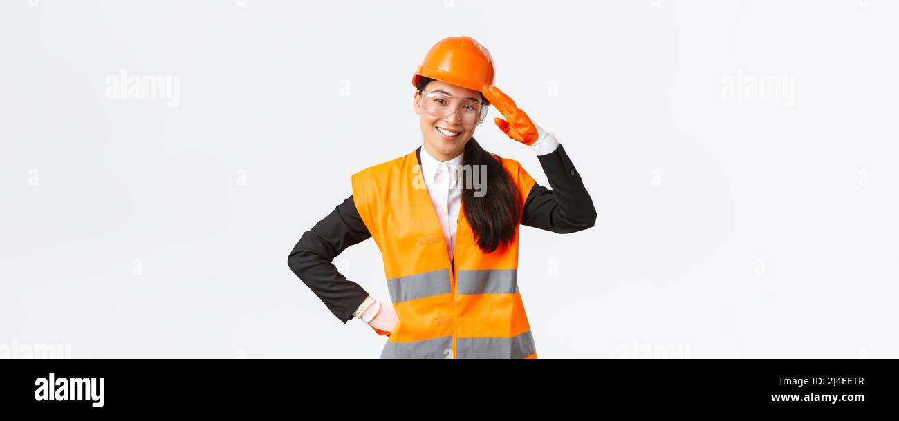 Confident smiling, friendly asian female construction manager, engineer ...