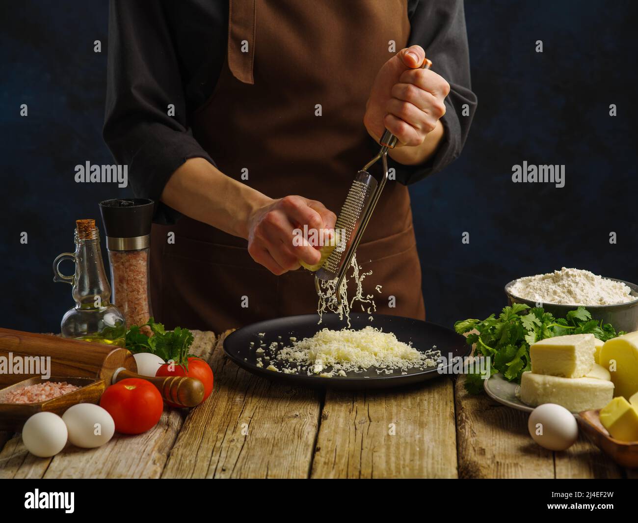 Female chef grates cheese on hi-res stock photography and images - Alamy