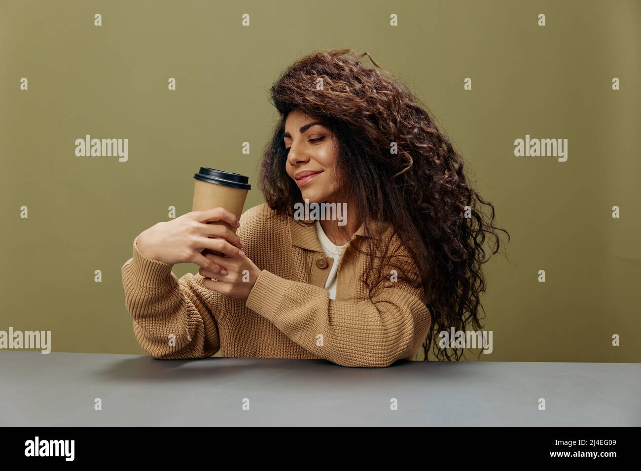 MORNING HELPER CONCEPT. Enjoyed tanned curly Latin female look at ...