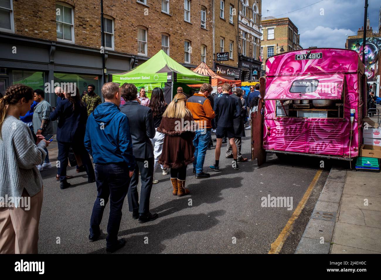 London Street Food Market Whitecross Street - City workers buy lunch at ...