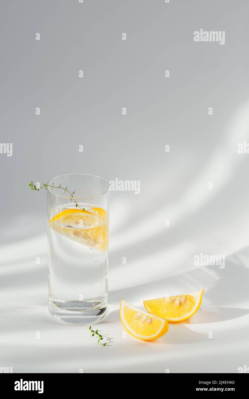 Glass of clean mineral sparkling water with ice and lemon Stock Photo - Alamy
