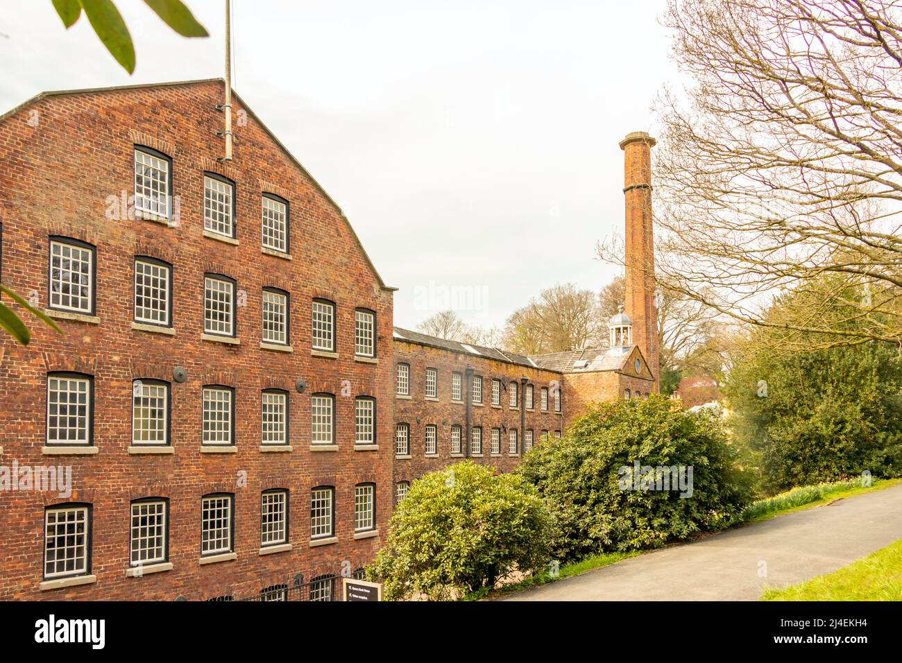 Dunham Massey red brick textile mill building and chimney Stock Photo ...