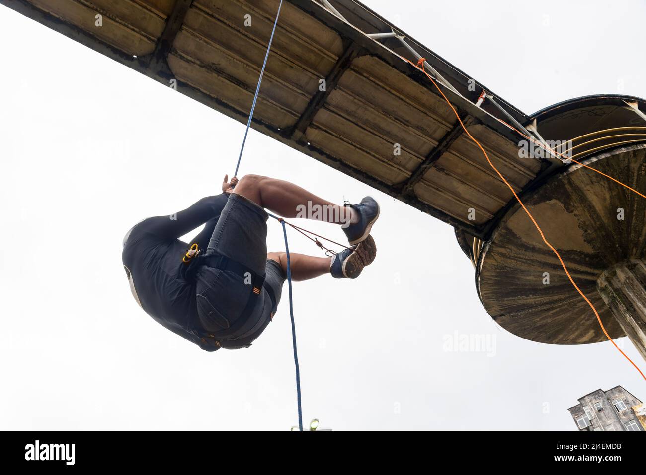 Salvador, Bahia, Brazil - October 24, 2021: Rappelist man going up the ...