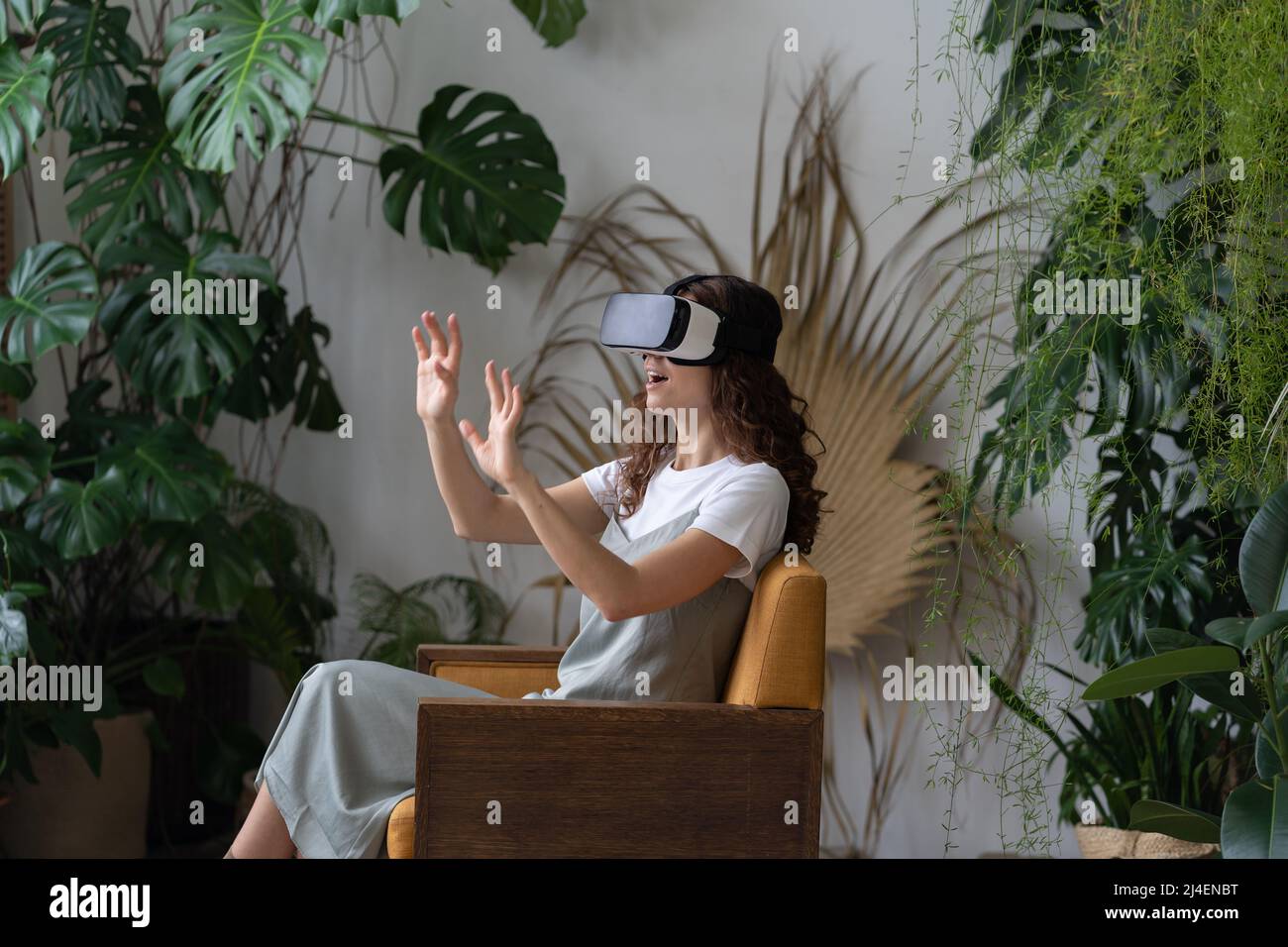 Excited woman wear vr glasses simulator with open mouth enjoy ...