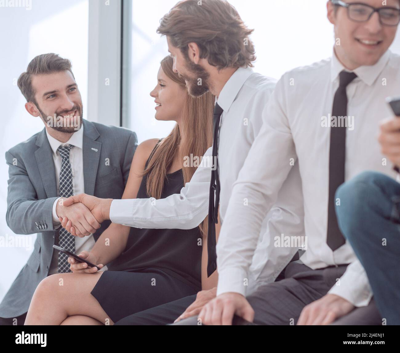 business people greet each other with a handshake Stock Photo - Alamy