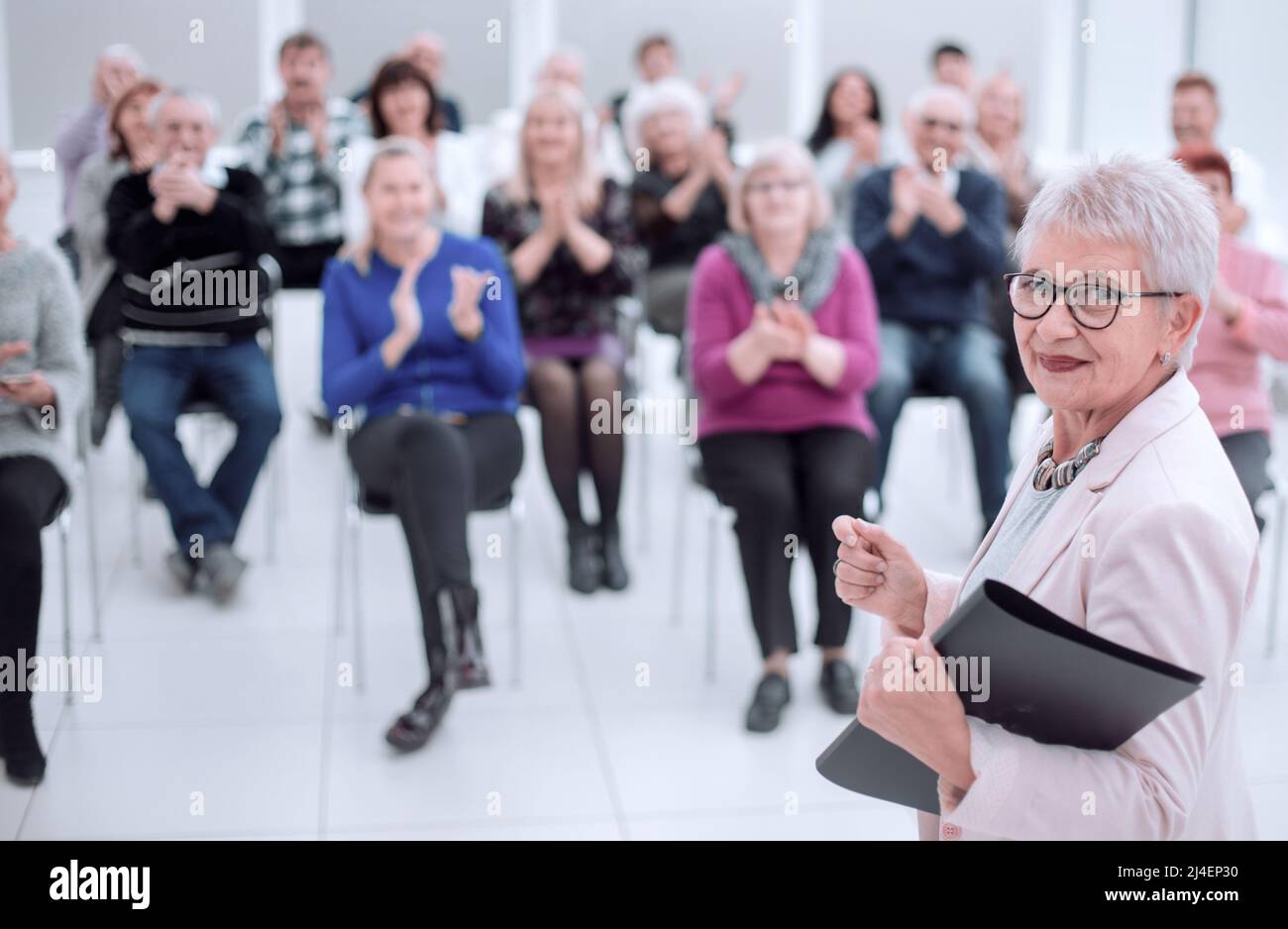 Woman addressing colleagues hi-res stock photography and images - Alamy