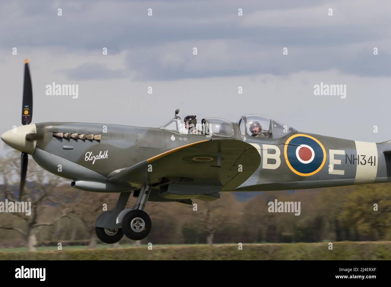 Spitfire taking off and landing at Kent airfield Stock Photo - Alamy