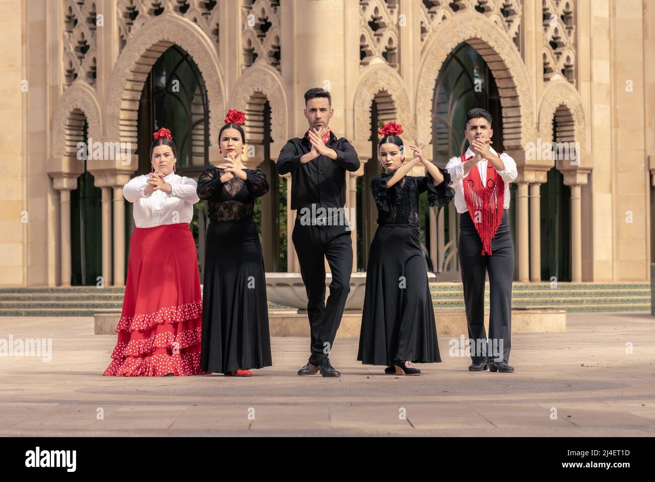 spanish group of flamenco dancers playing hand clapping in a group ...