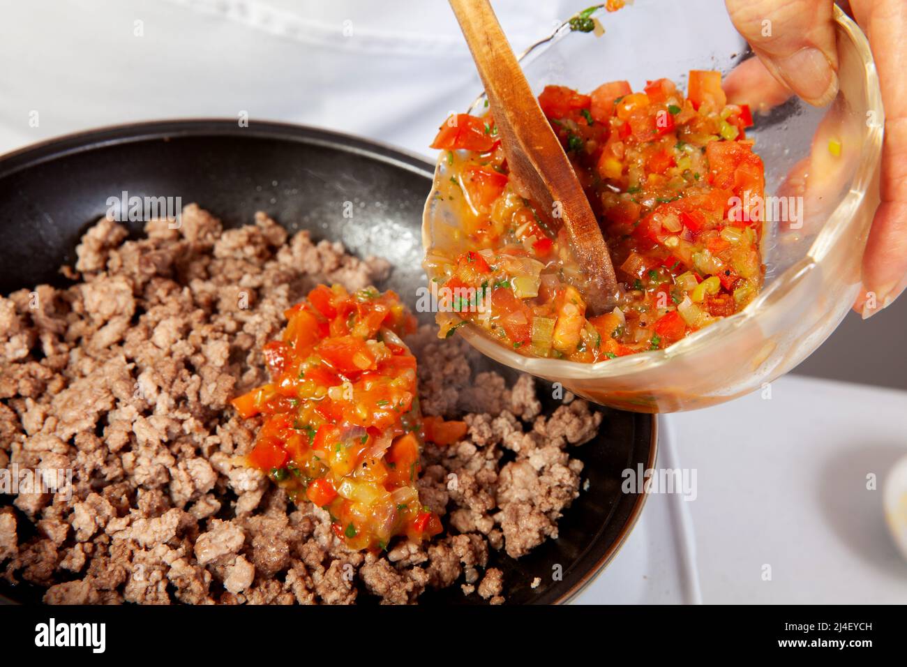 Preparation of ground beef with the traditional Colombian hogao or ...