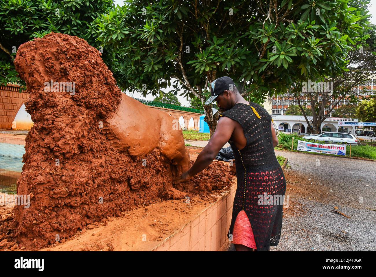 Yaounde, Cameroon. 13th Apr, 2022. A sculptor works on his artwork at ...