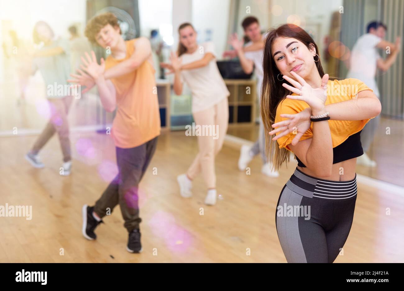Teens performing modern dance in studio Stock Photo - Alamy