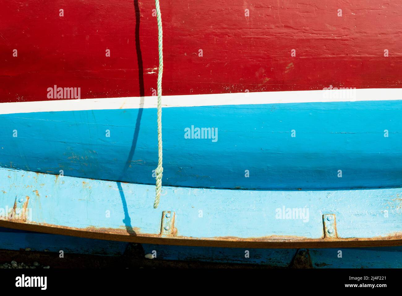 Side of red and blue boat with the keel on the bottom of the hull Stock ...