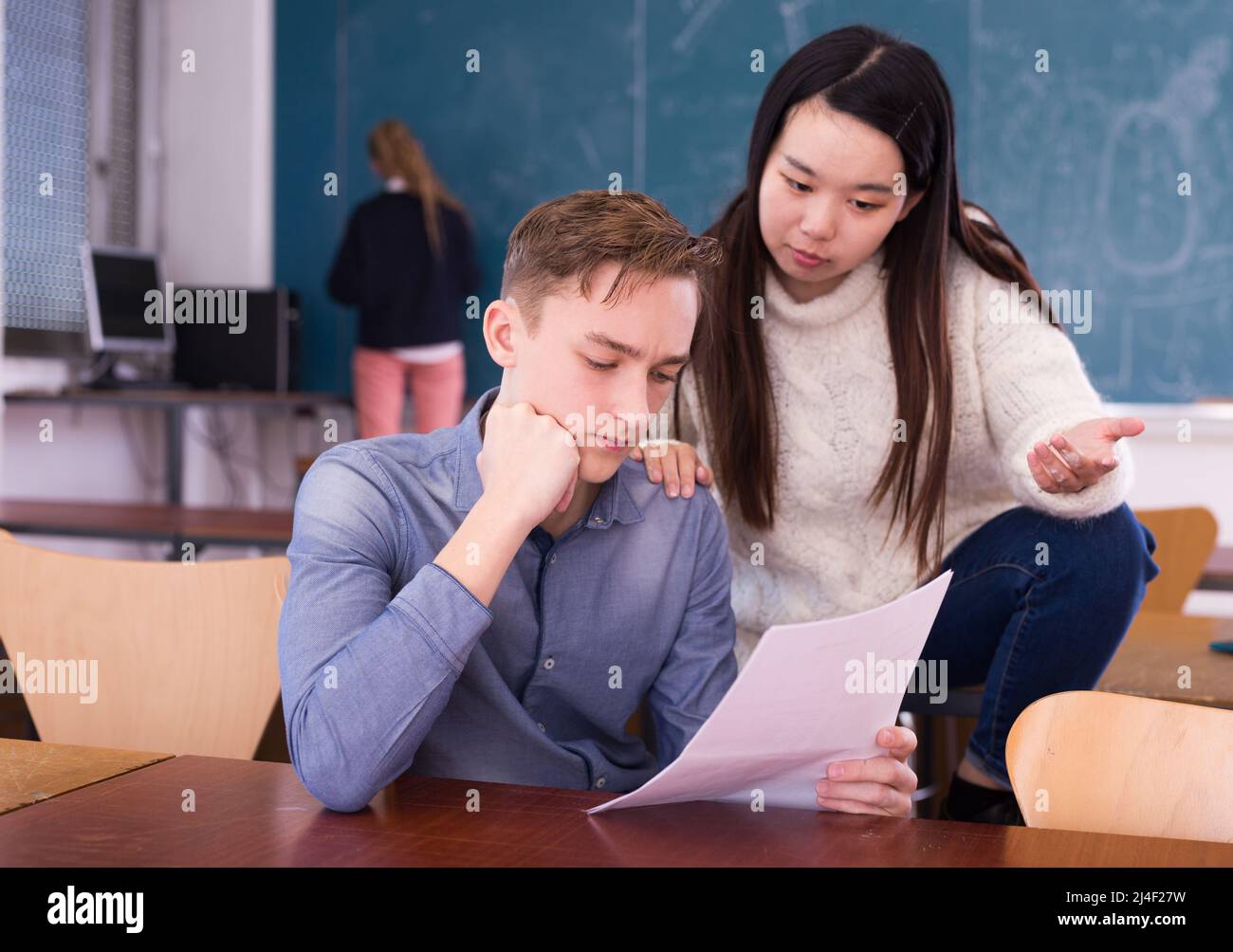 Asian girl student comforting teenager with failed exam Stock Photo - Alamy