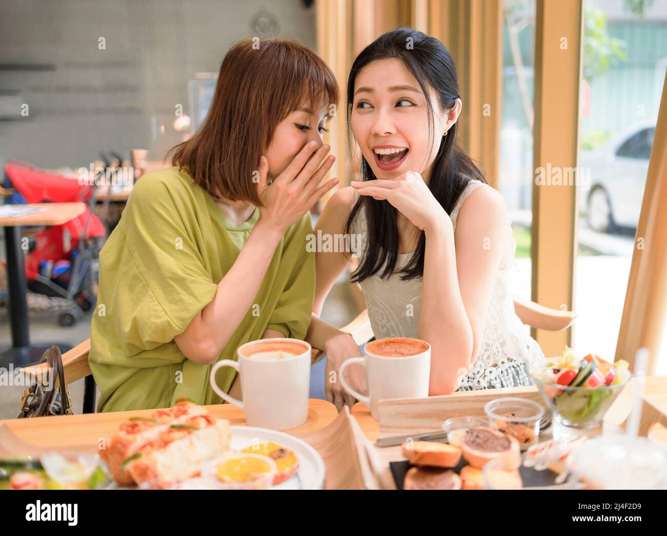 Chinese people talking in ears hi-res stock photography and images - Alamy