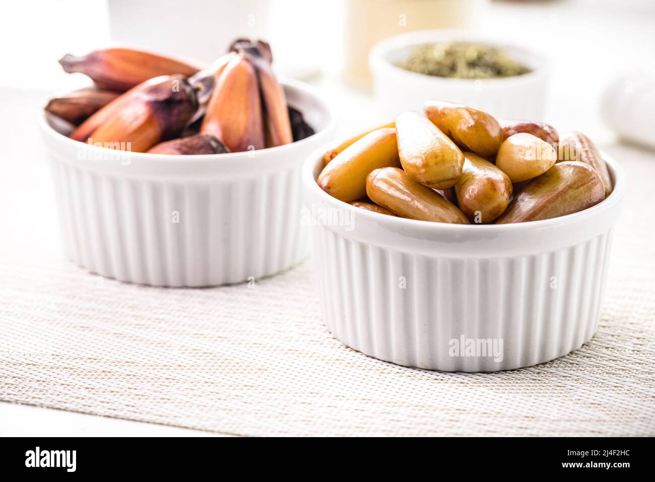 pine nuts in a rustic wooden bowl, traditional food of the Brazilian ...
