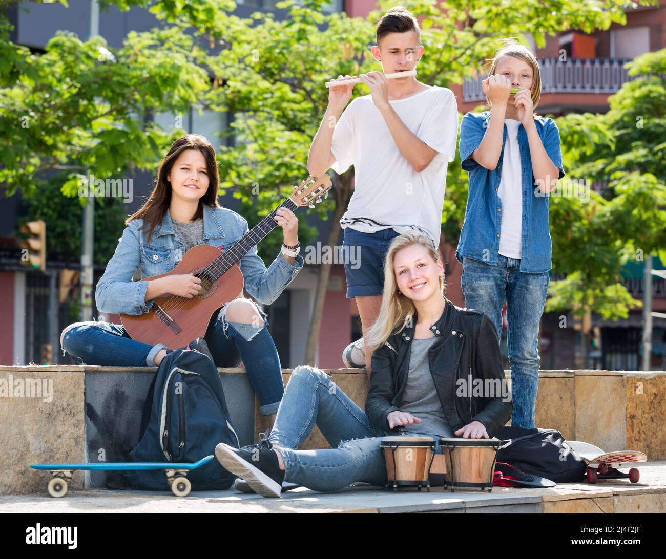 Young musicians playing by instruments Stock Photo - Alamy