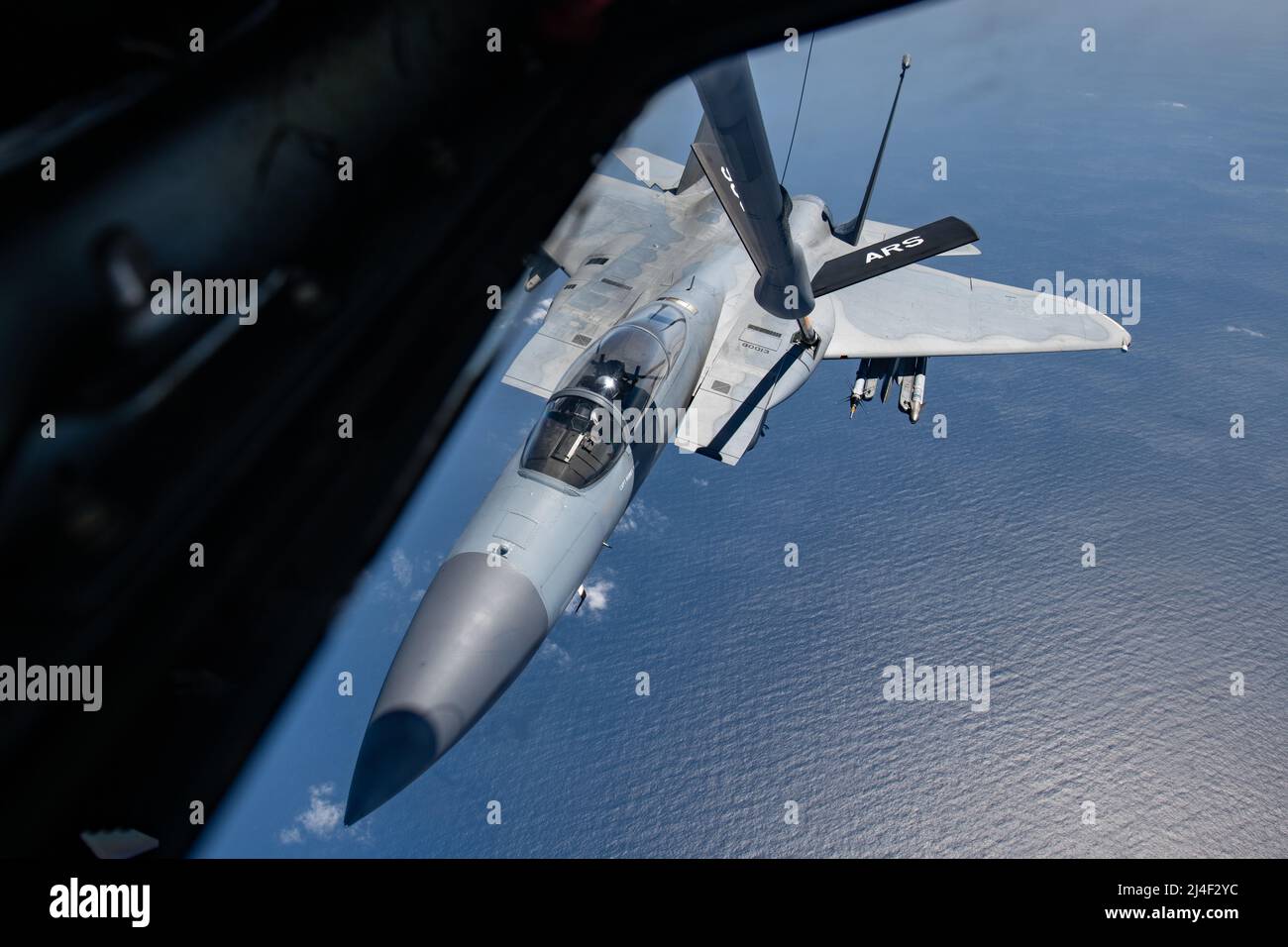 A 44th Fighter Squadron F-15C Eagle is refueled by a 909th Air ...