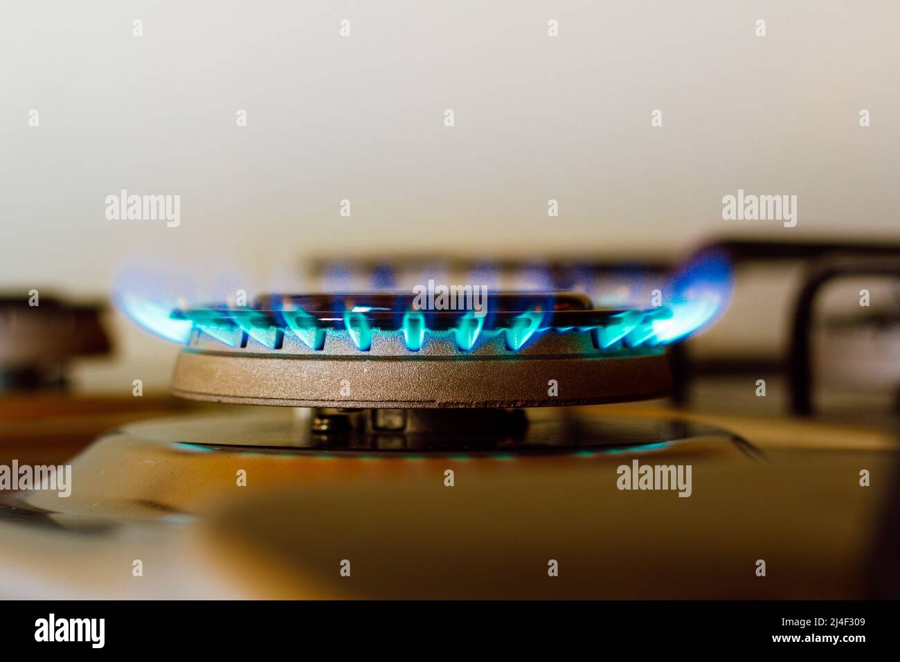 In this photo illustration the blue flame produced by cooking gas ...