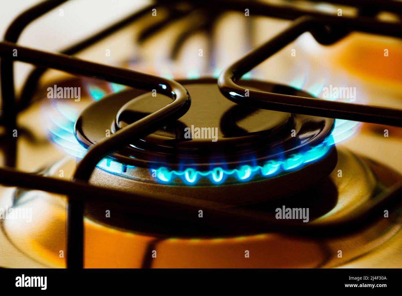 In this photo illustration the blue flame produced by cooking gas ...