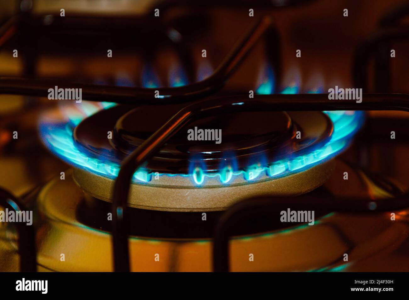 In this photo illustration the blue flame produced by cooking gas ...