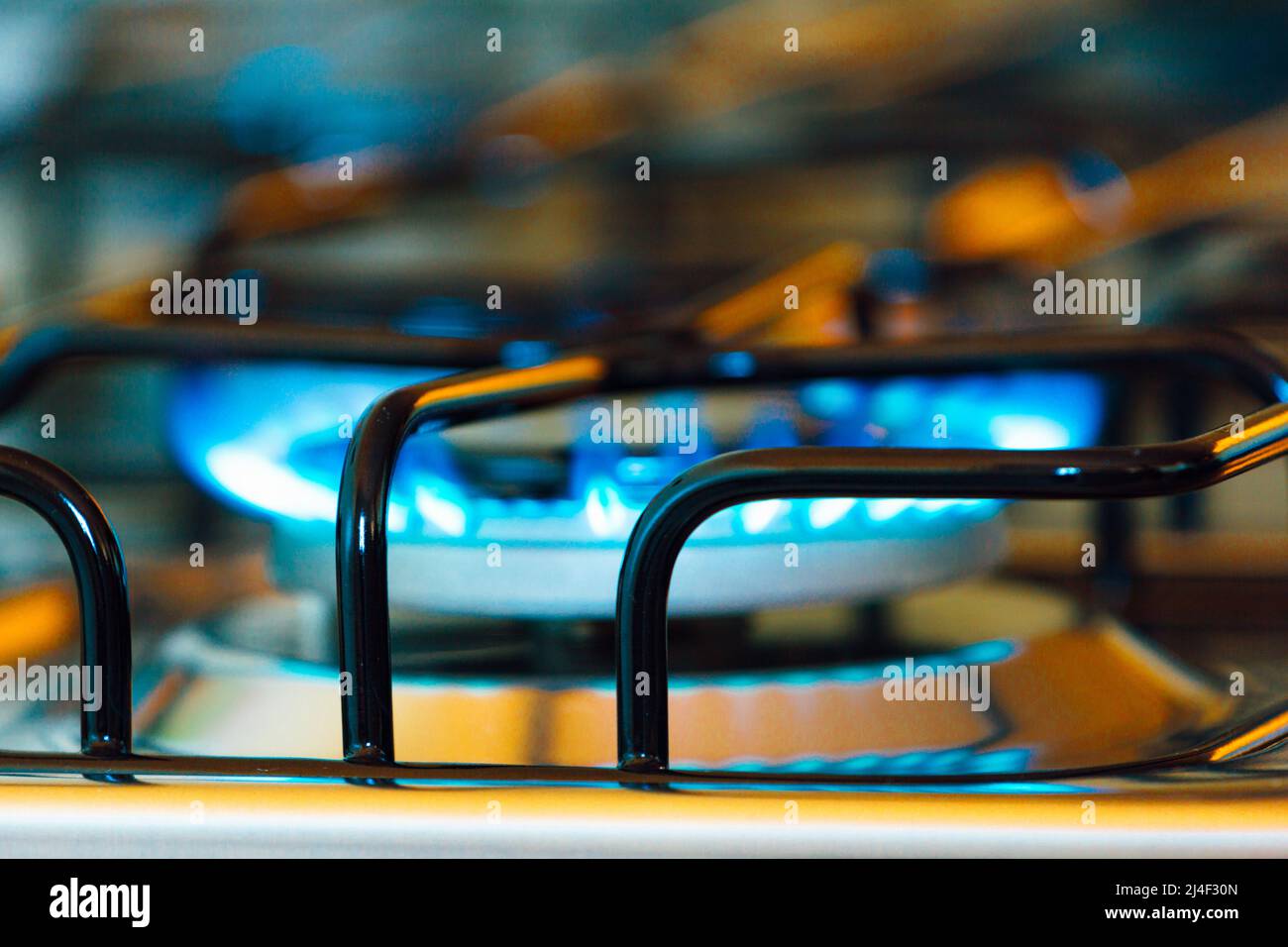 In this photo illustration the blue flame produced by cooking gas ...