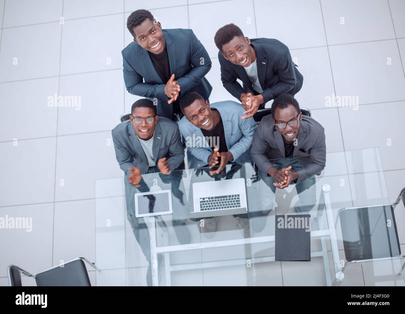 business team discussing the online information in the workplace Stock Photo - Alamy