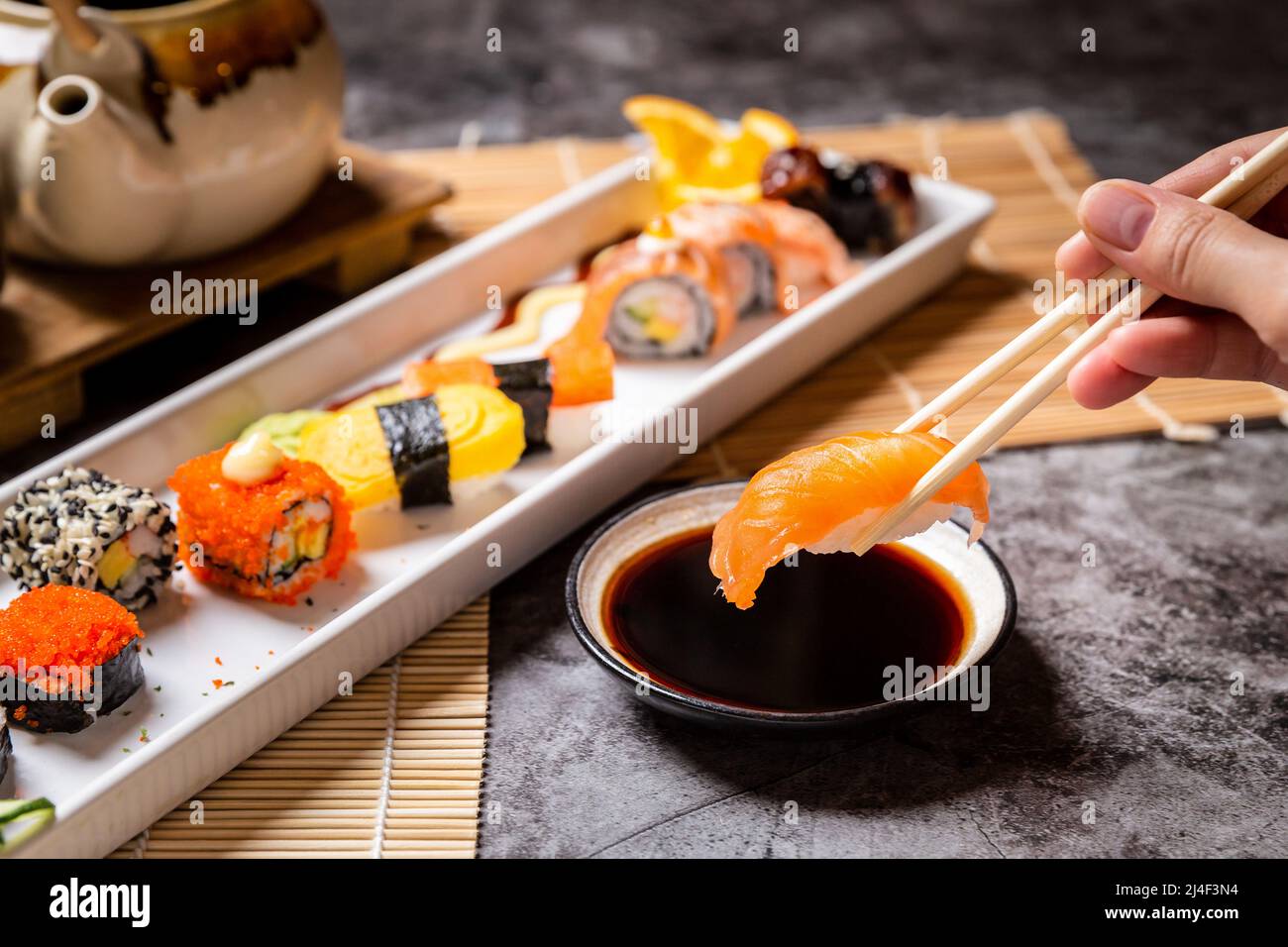 Delicious sushi arranged in plates and ready to serve Stock Photo - Alamy