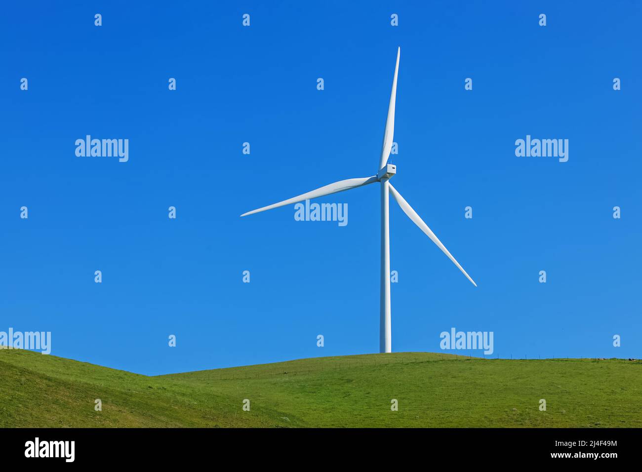 Electrical wind power mill over the blue sky. Alternative energy source ...