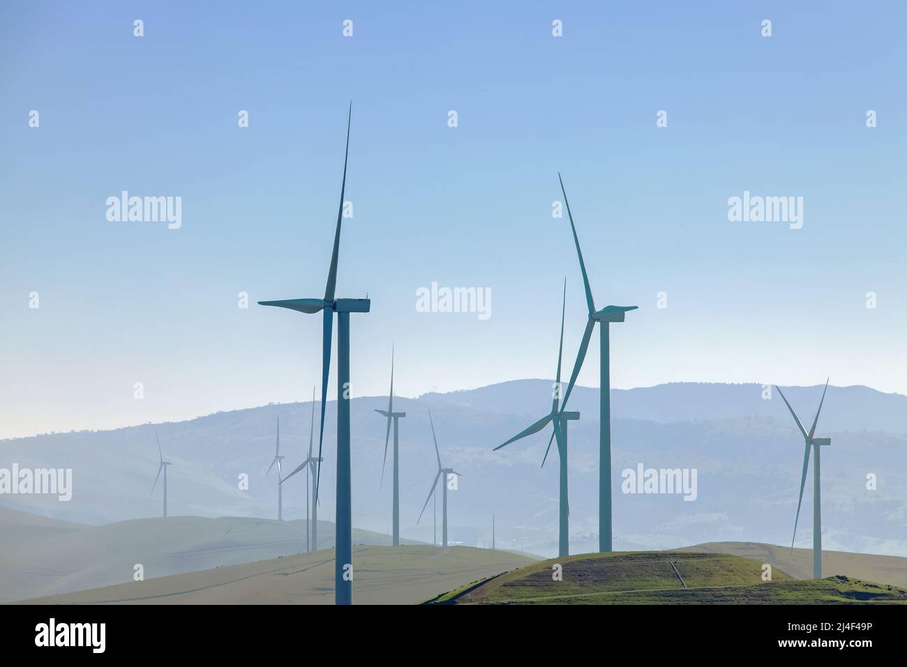 Electrical wind power mill over the blue sky. Alternative energy source ...