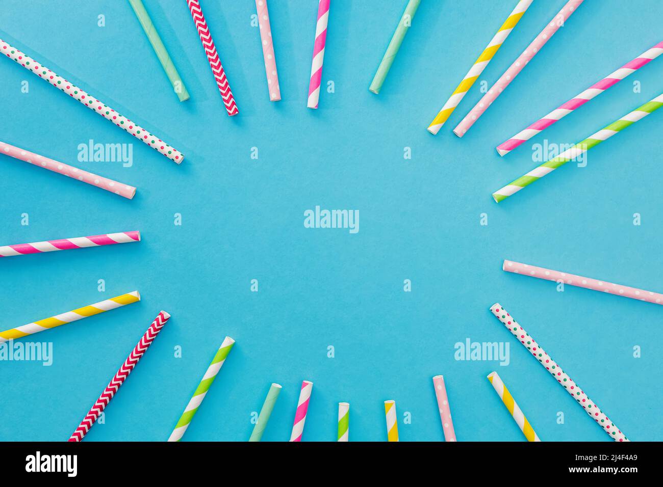 Colorful paper straws on the blue background. Birthday party Stock ...