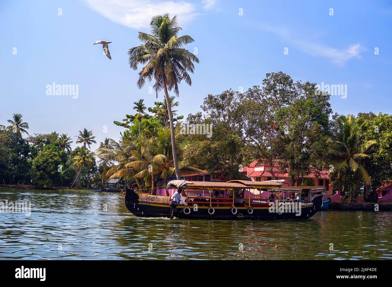 Tourists sailing on a pleasure boat in the canals of Venice Indian ...