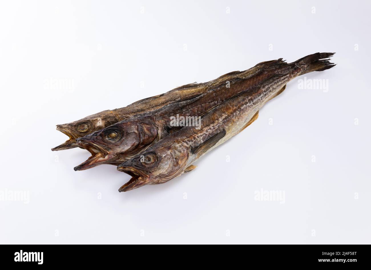 3 dried pollack on white background Stock Photo - Alamy