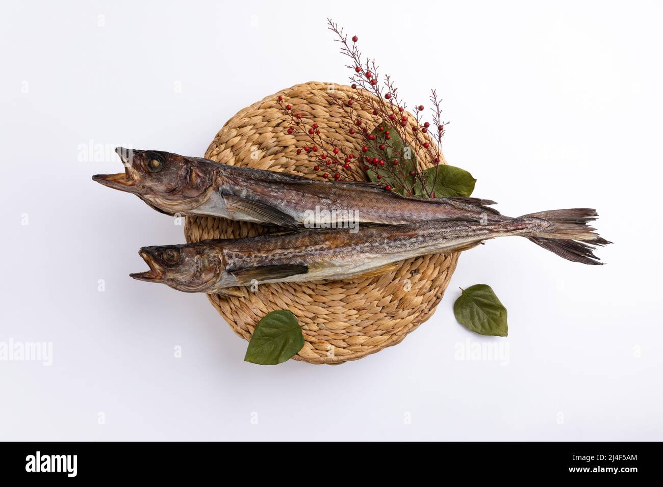 Two dried pollack on a white background viewed from above Stock Photo ...