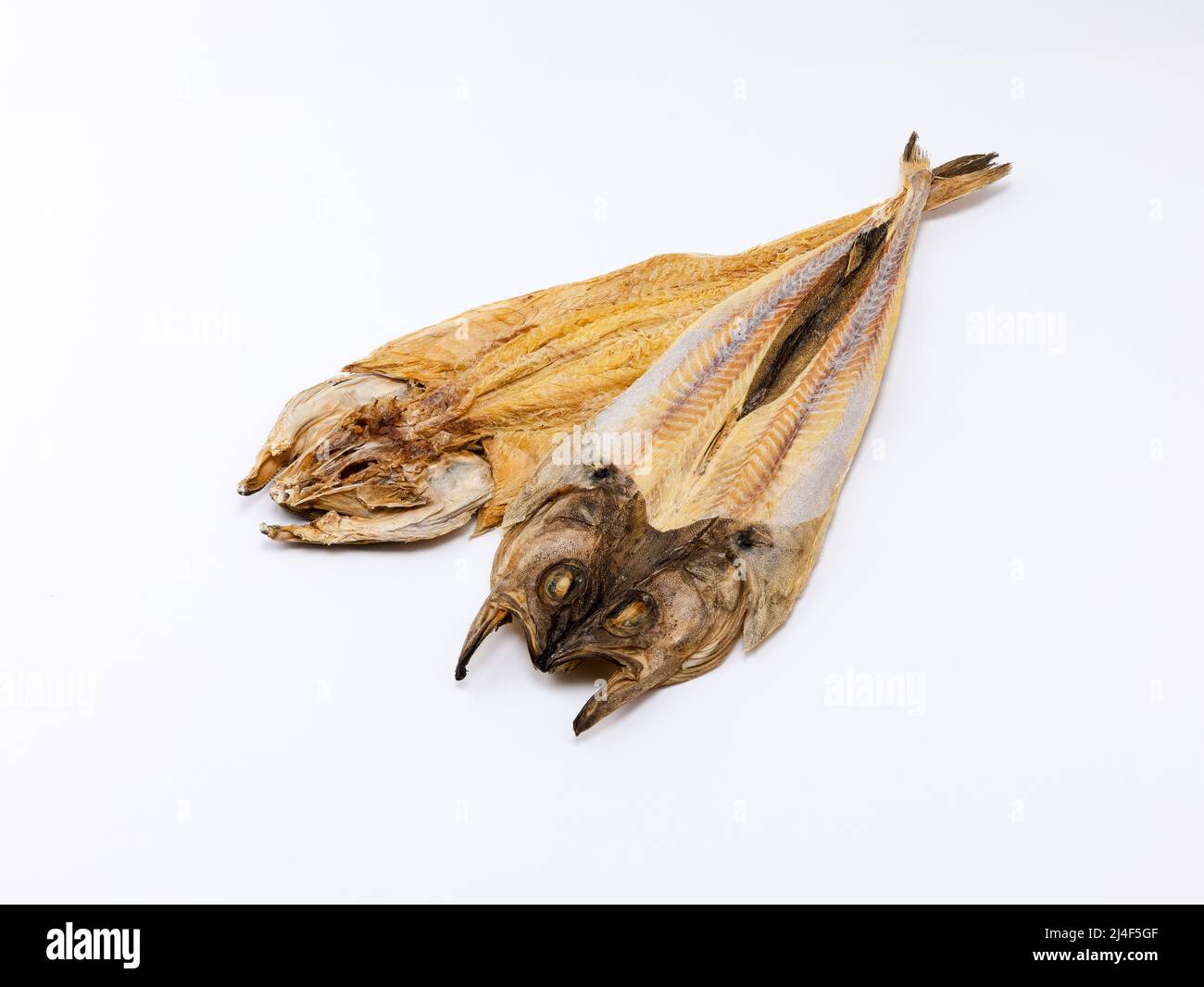 dried pollack on white background Stock Photo - Alamy