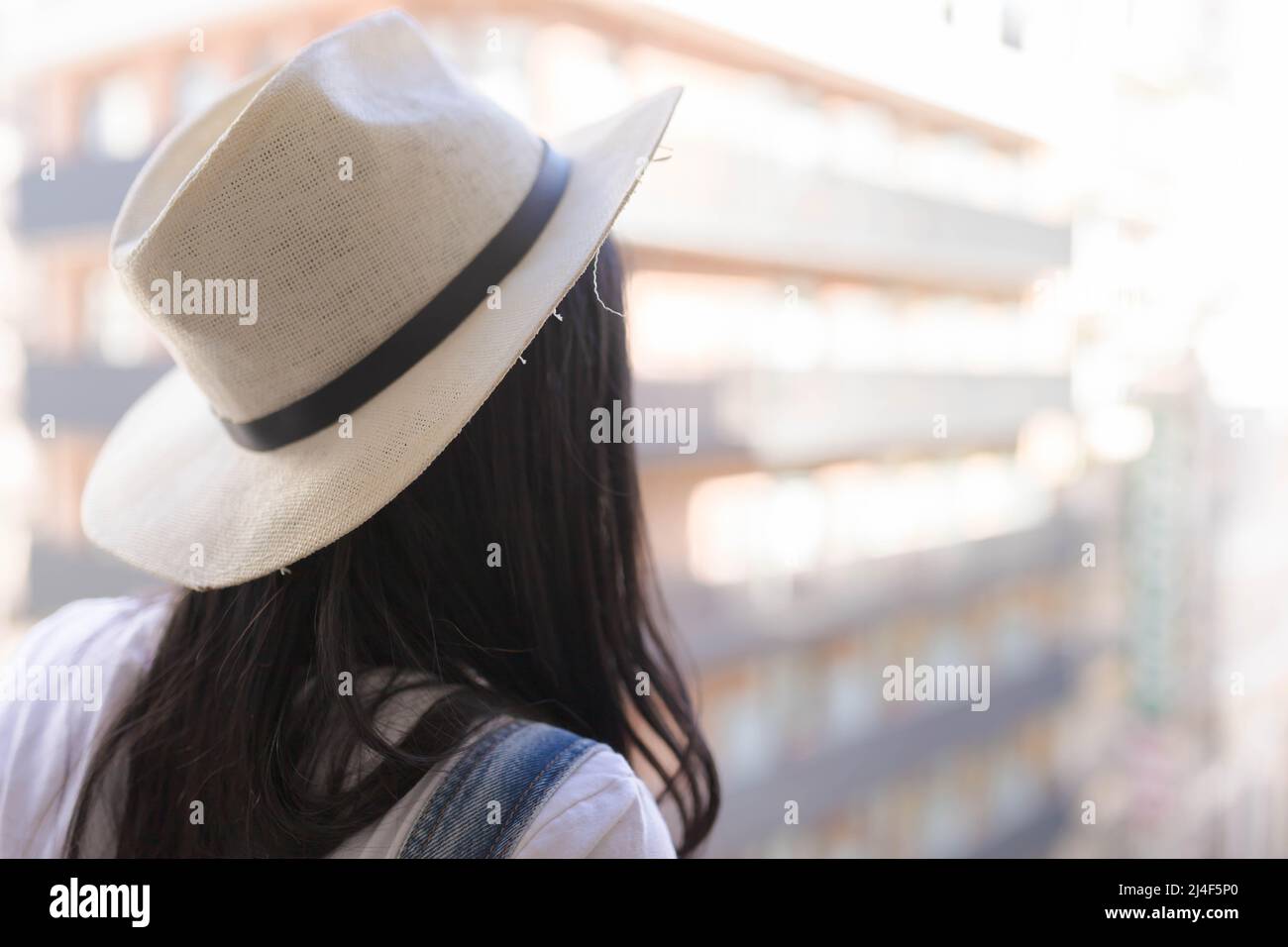 Happy rich young woman wear night robe stand at big window open lace ...