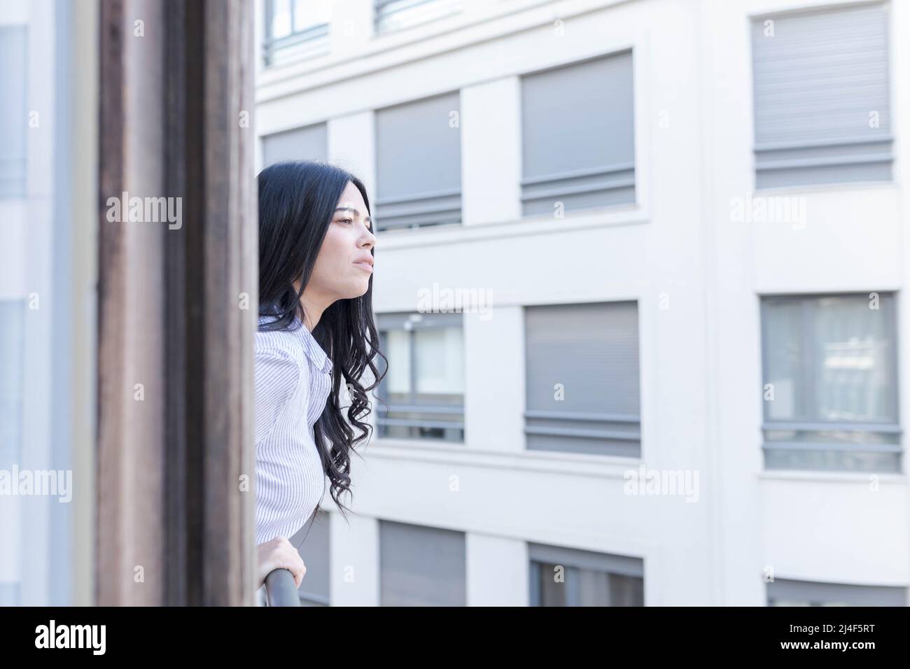 Happy rich young woman wear night robe stand at big window open lace ...